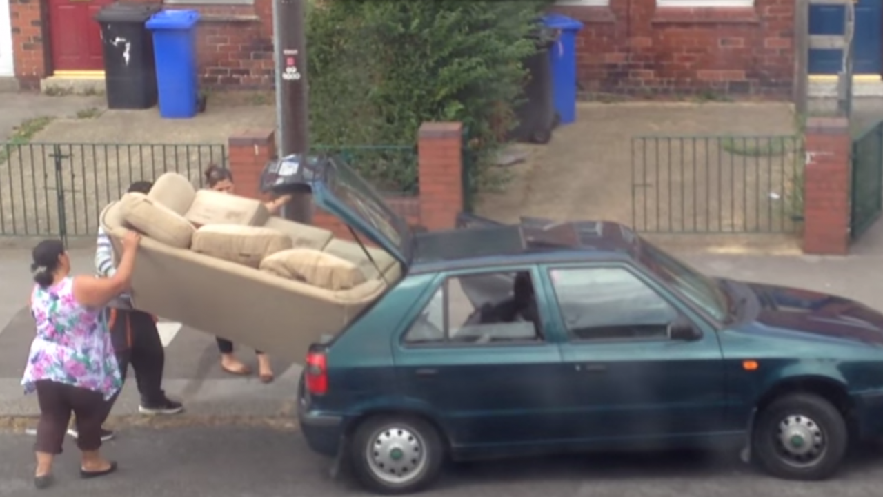 VIDEO: Family try to fit sofa in car boot