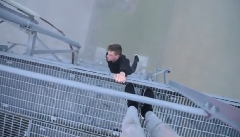 Terrifying moment daredevils battle wind and rain to climb Northfield ...