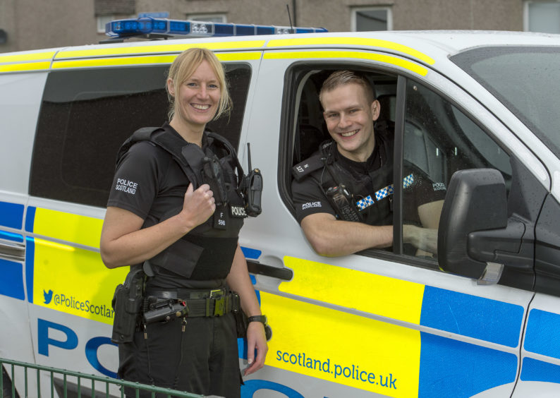 Inverness police officers who kicked their way into burning flat ...