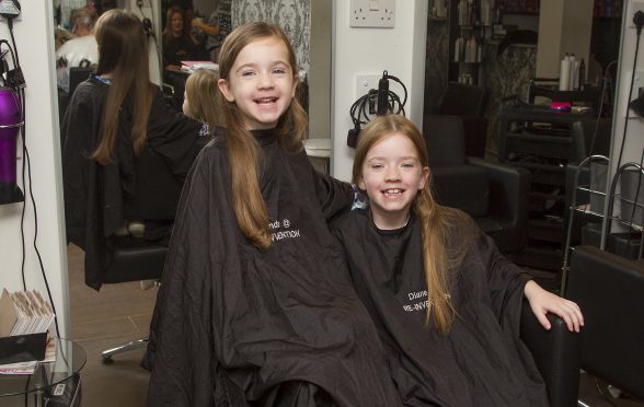 Angus sisters' haircuts for good causes