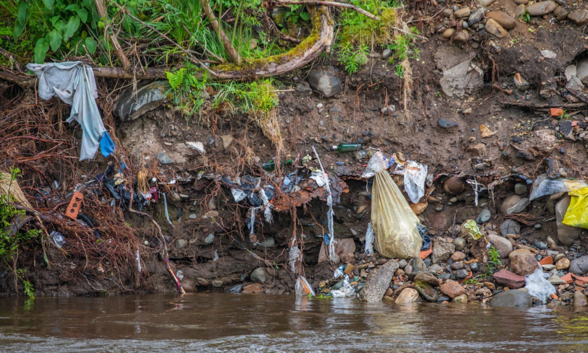 Household rubbish from 1960s found in Perthshire river as landfill erodes.