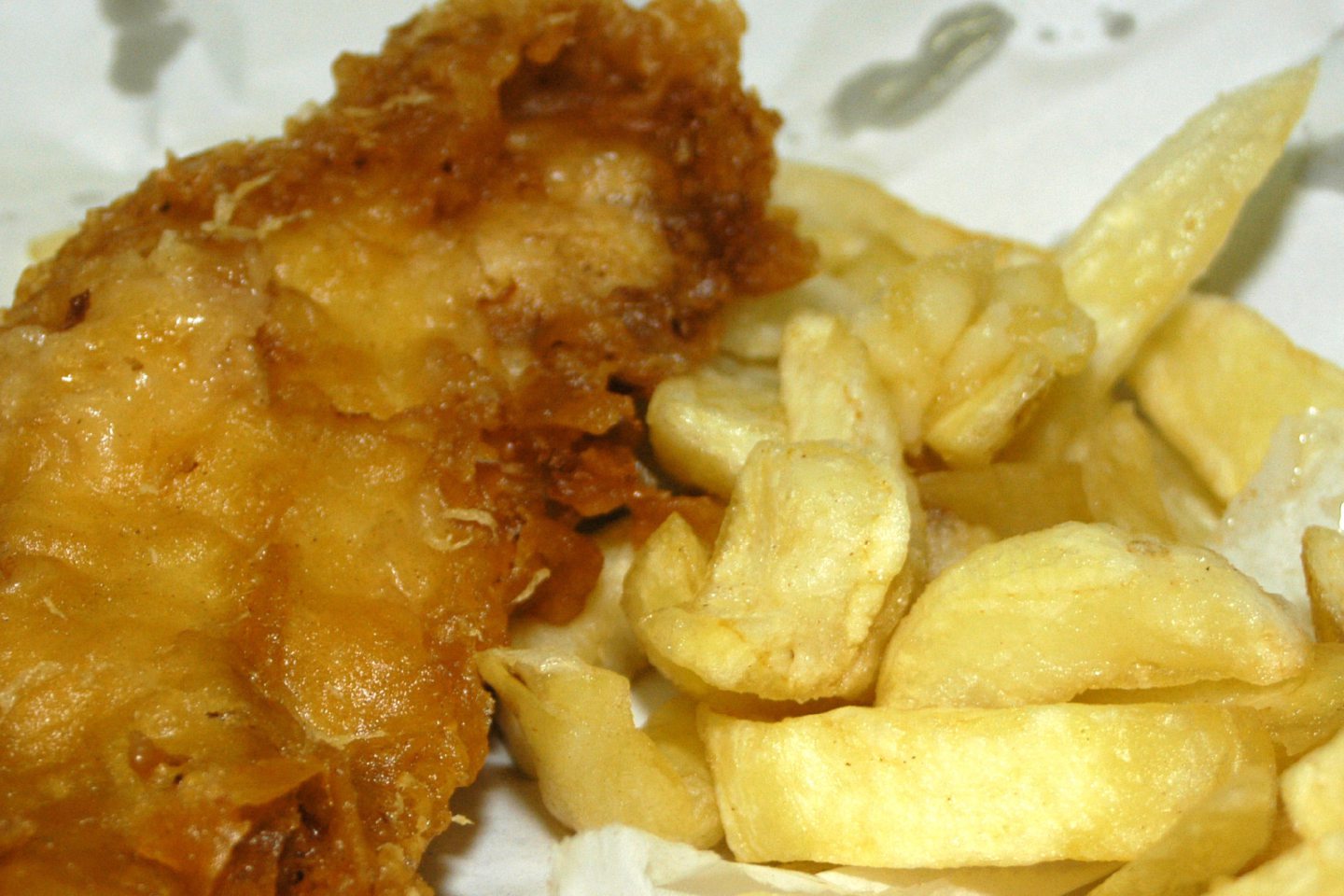 Woman spat and threw beer at Perth chip shop boss in racist attack
