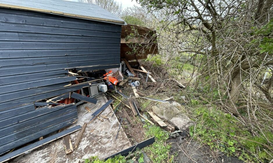 Car hits garage and crashes down 40ft bank in Inverkeithing