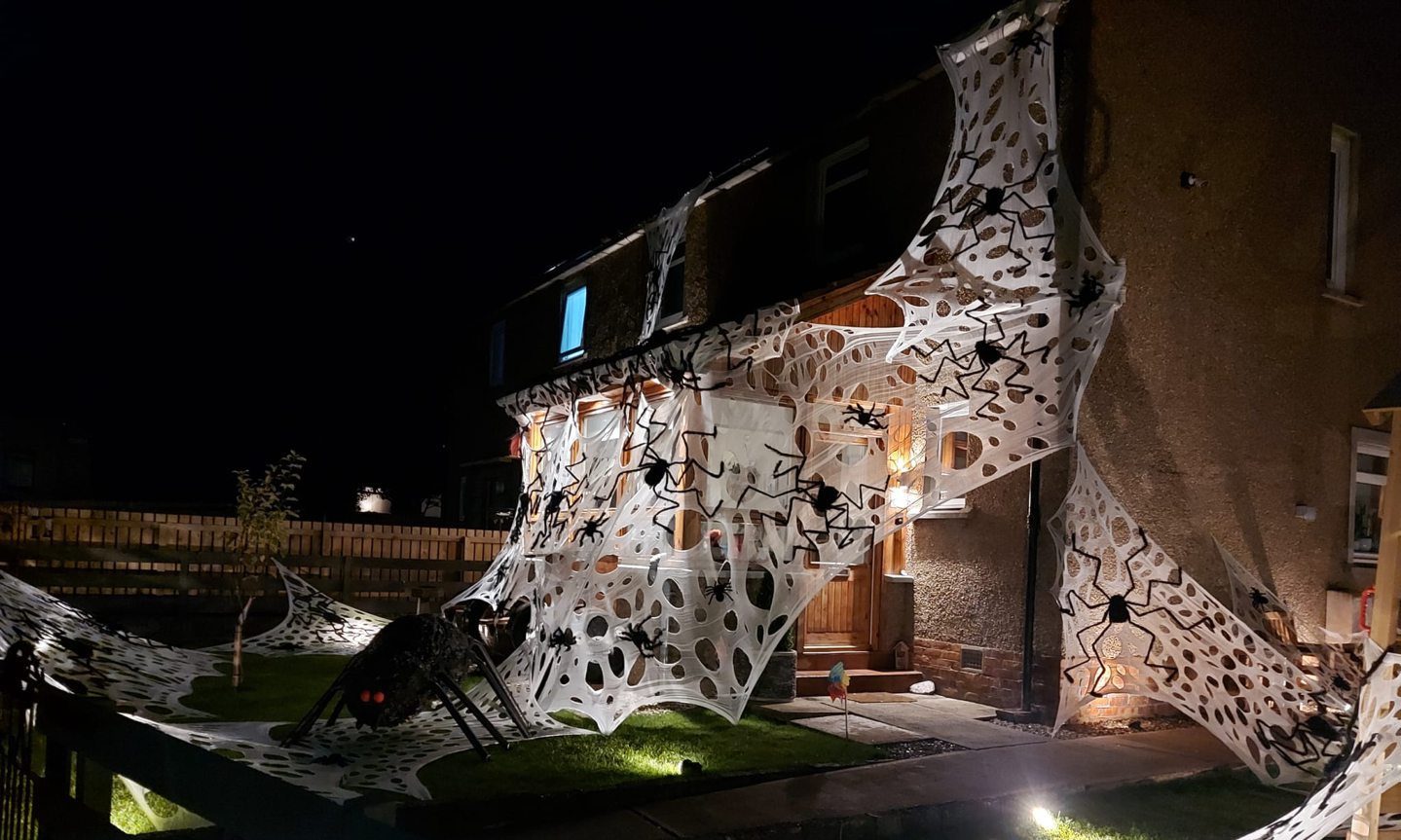 Brechin family cover house in Halloween spider's web