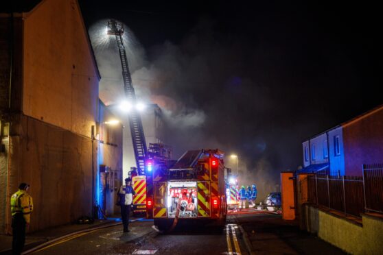 Multiple fire crews tackling large blaze at block of flats in Lochgelly
