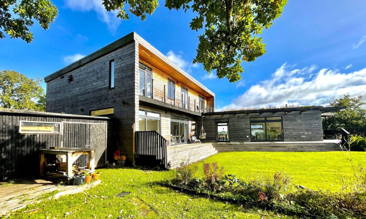 Timber clad house near Milnathort with living roof built by owner