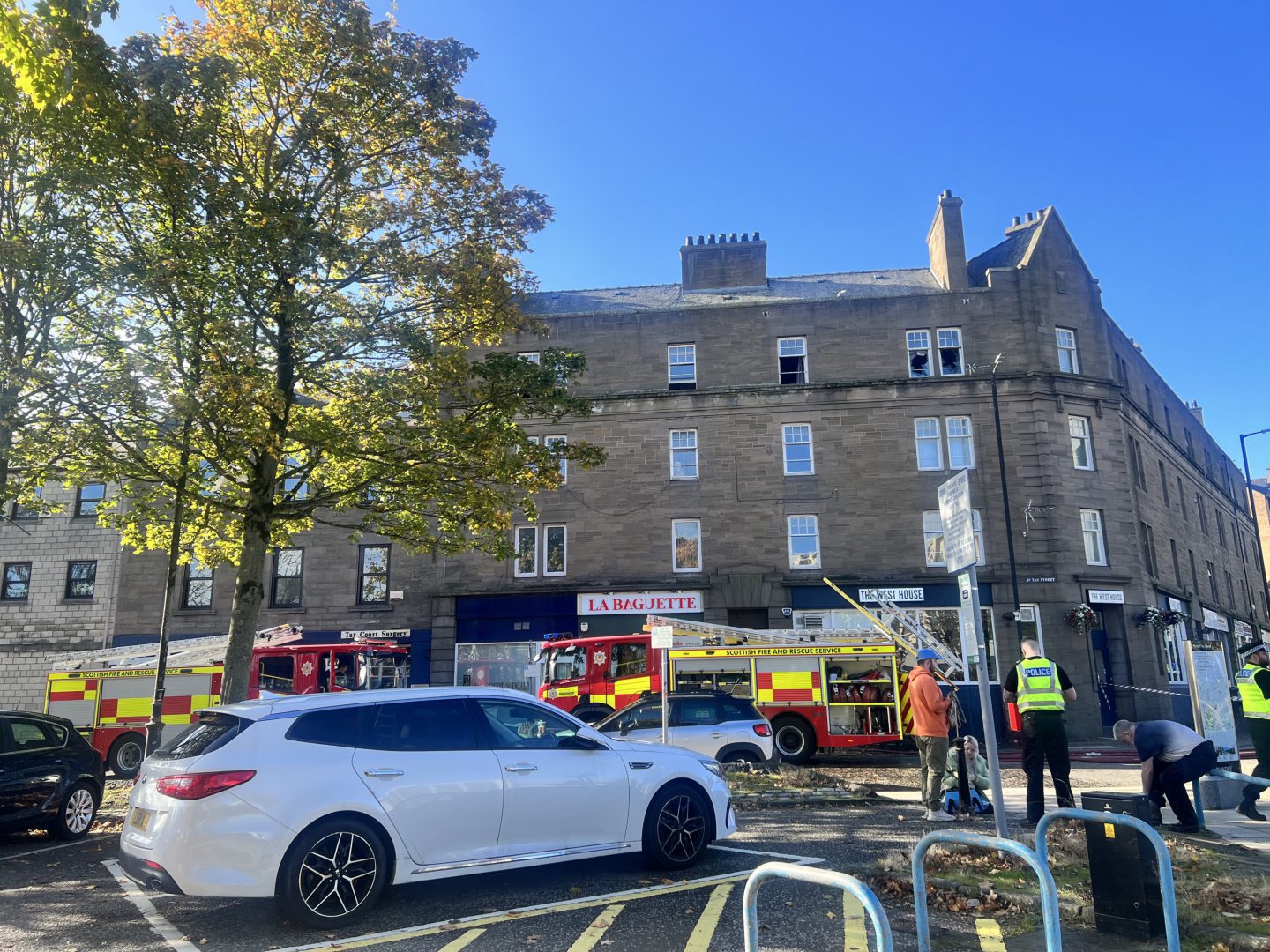 Police, firefighters and ambulance at blaze above Dundee bar