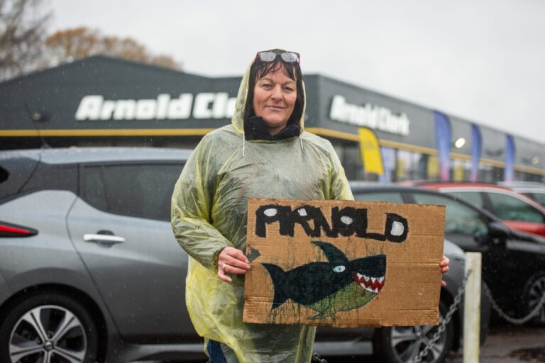 Woman holds protest at Dundee Arnold Clark in repairs bill dispute