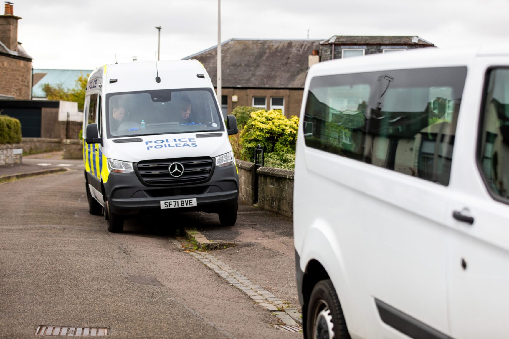 Police with dog in raid on home in Fairmuir area of Dundee
