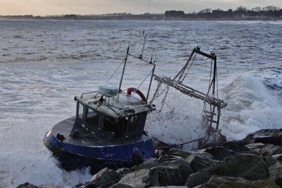 Dramatic images of stranded fishing boat near Arbroath