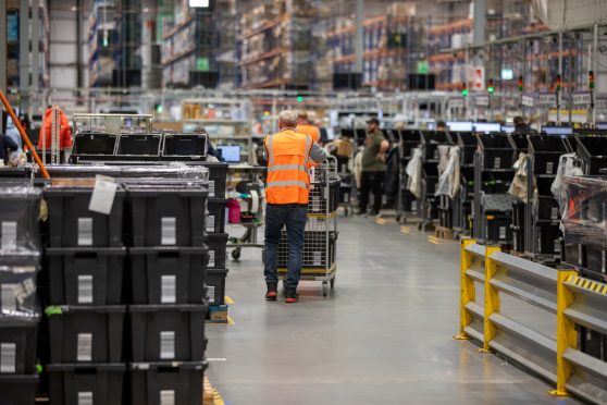 How does Fife's huge Amazon warehouse handle surplus goods?