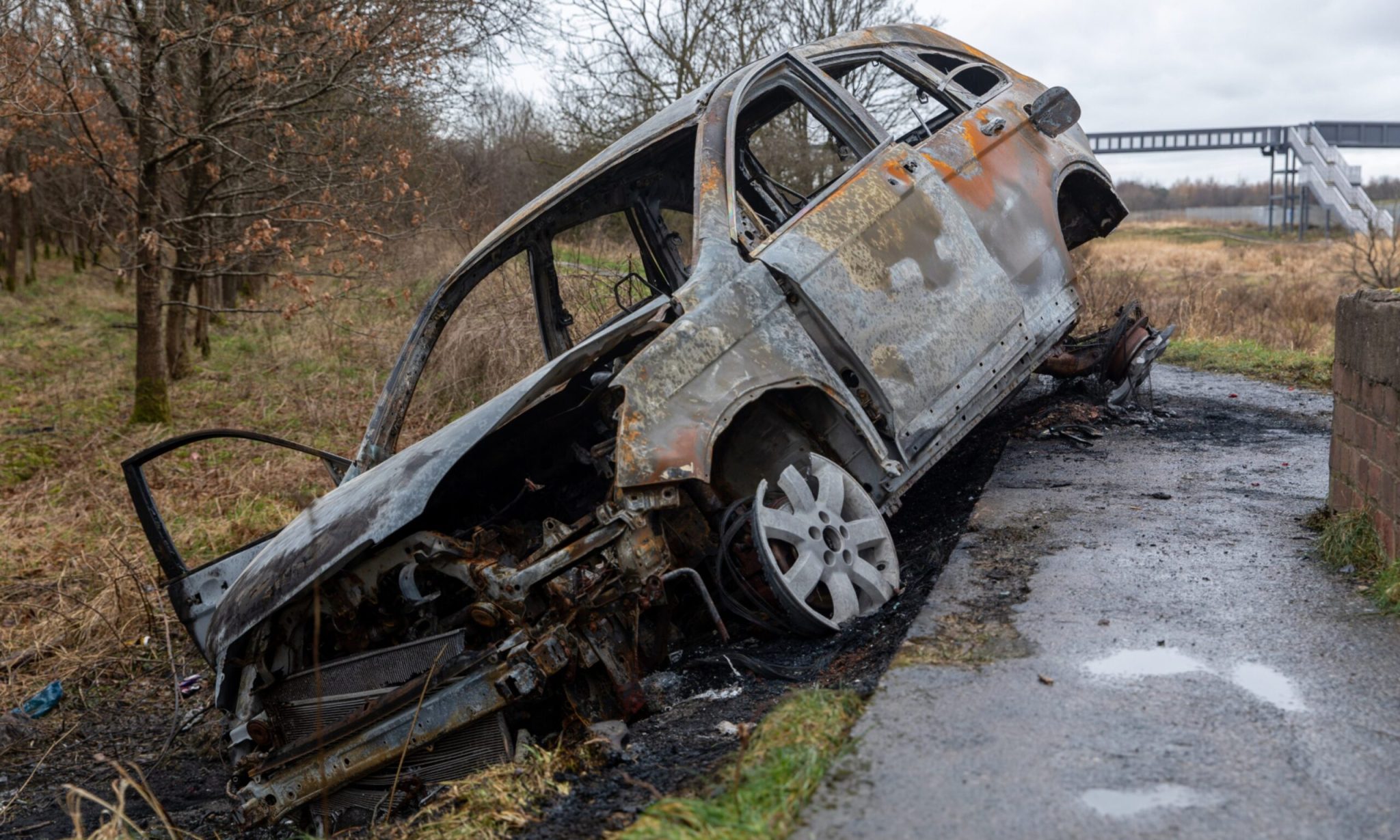 Burnt-out car abandoned near Cameron Bridge station in Methil