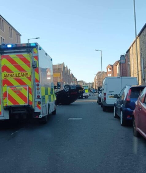Car flips onto roof during crash on Dundee's Arklay Street
