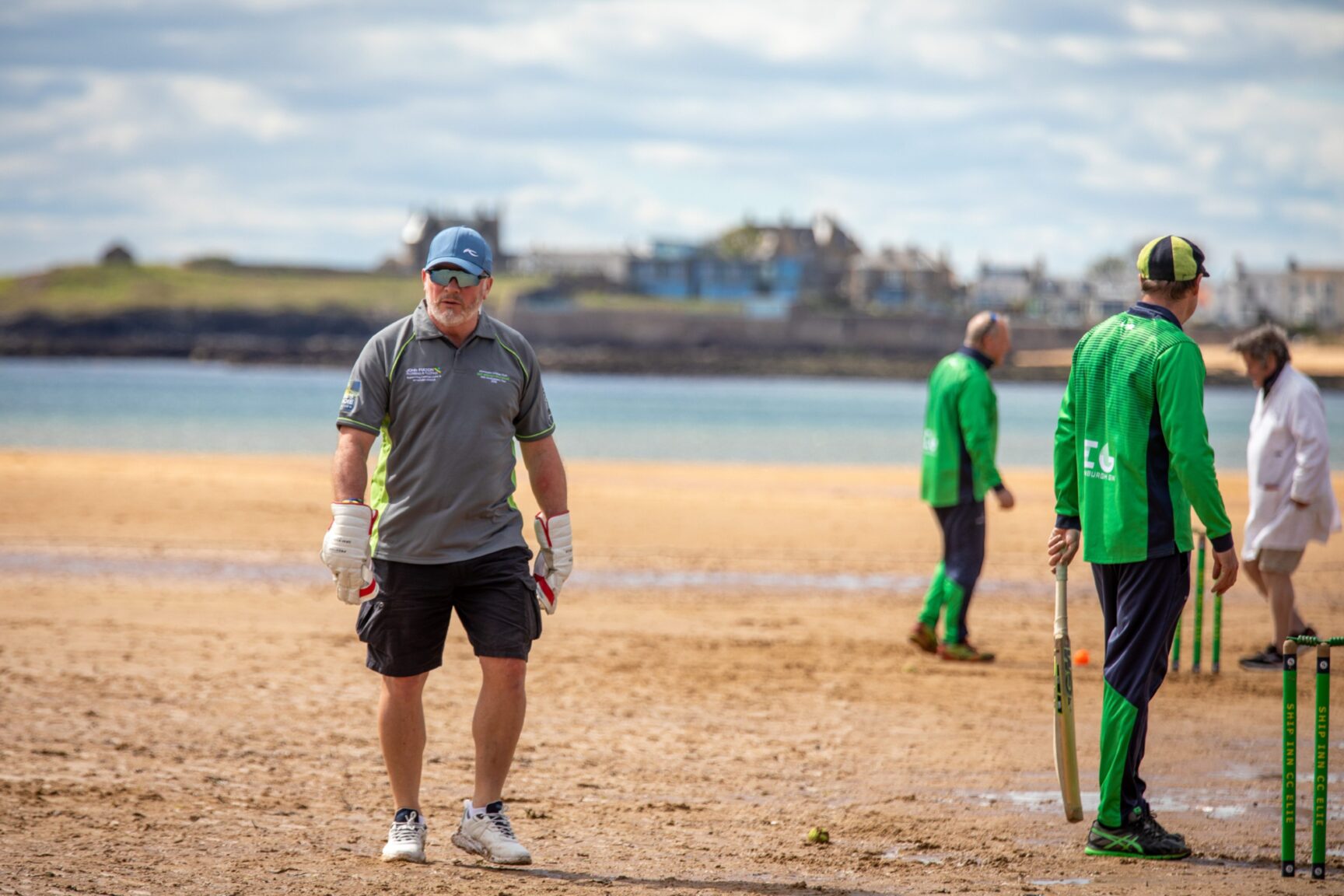 Ally McCoist plays wicketkeeper in beach cricket match at Elie