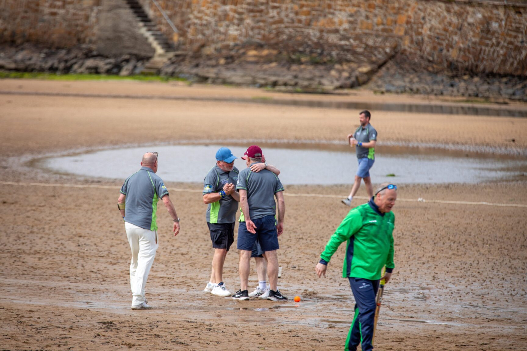 Ally McCoist plays wicketkeeper in beach cricket match at Elie