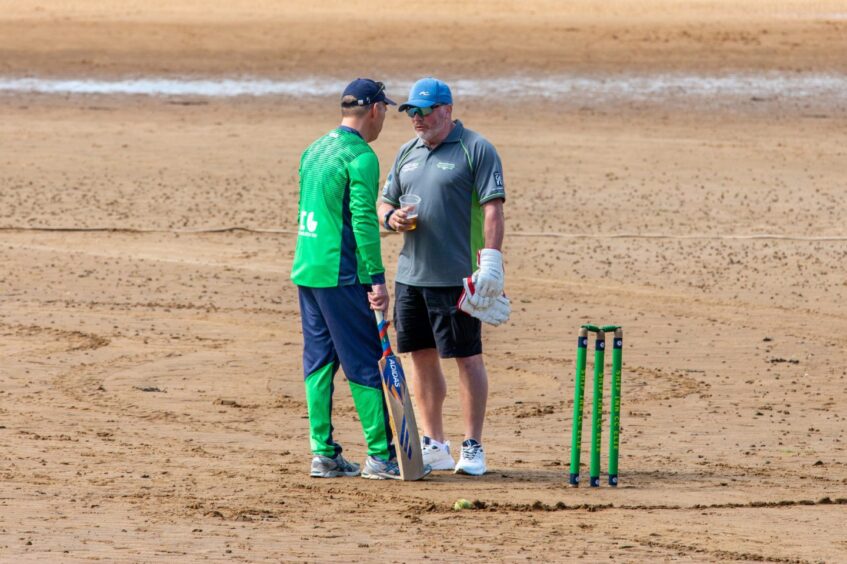 Ally McCoist plays wicketkeeper in beach cricket match at Elie