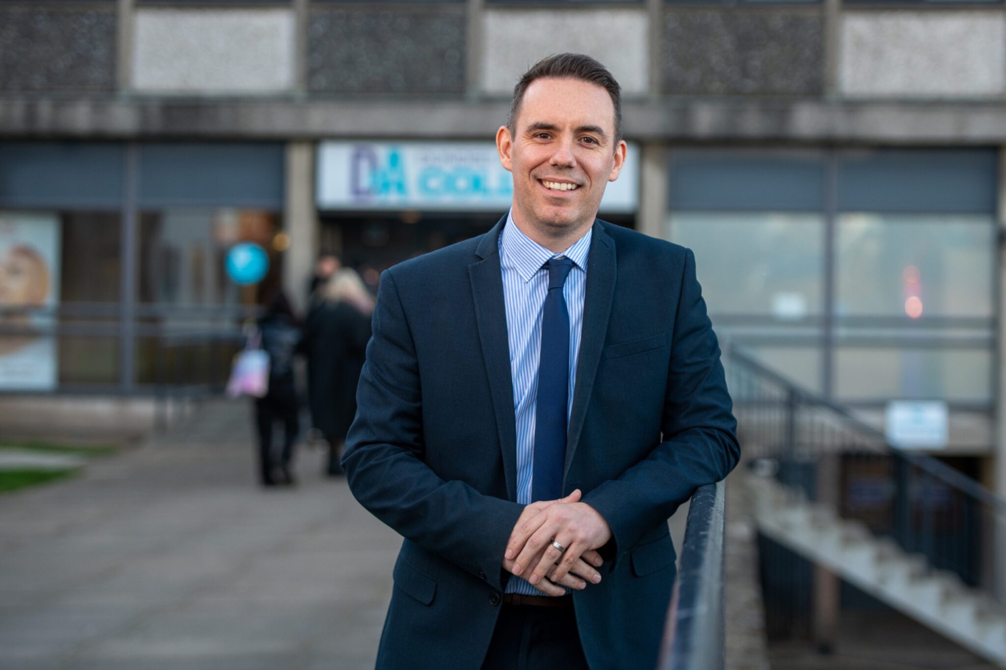 How is Dundee and Angus College funded?