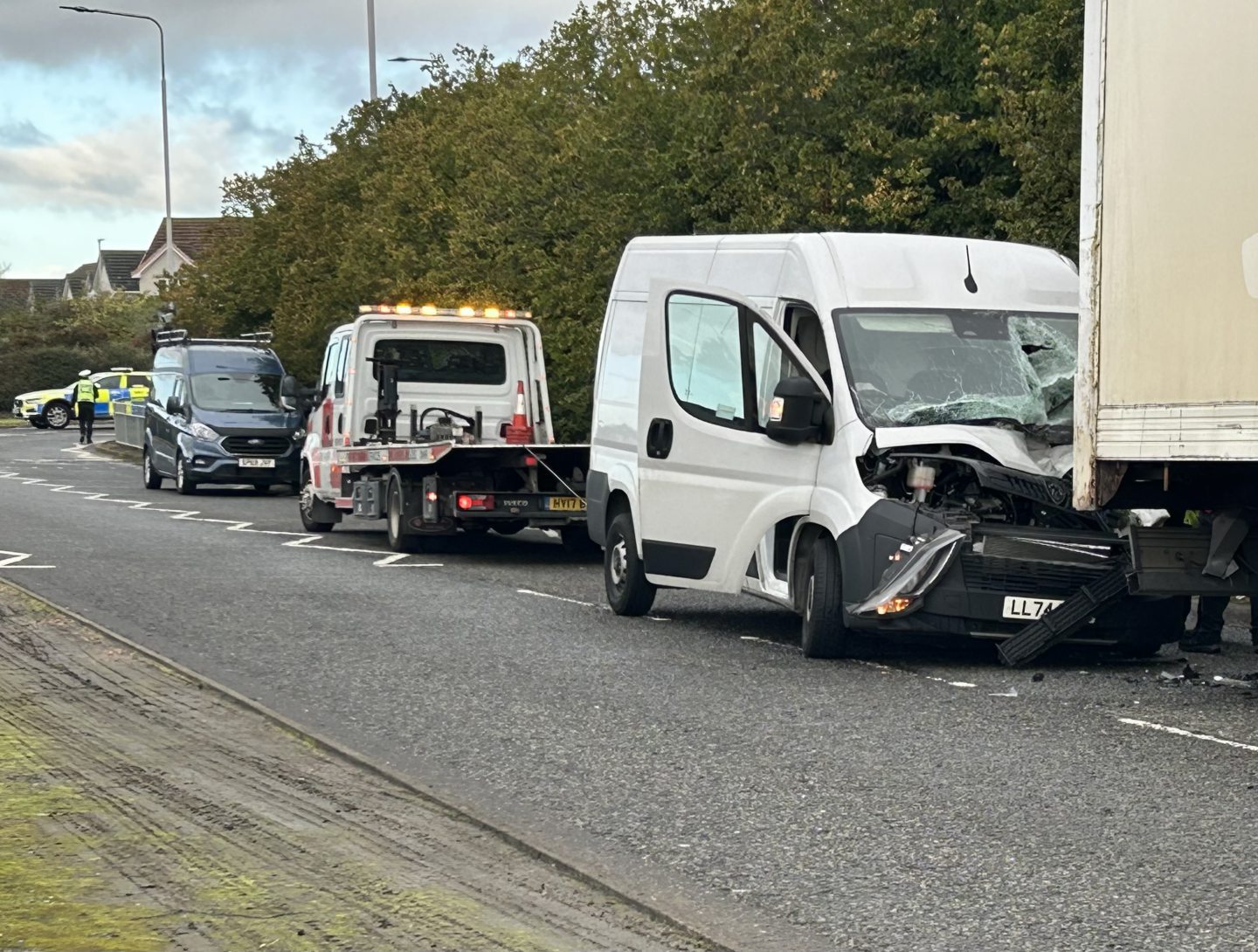 Van crashes into parked lorry with driver inside on Dunfermline road