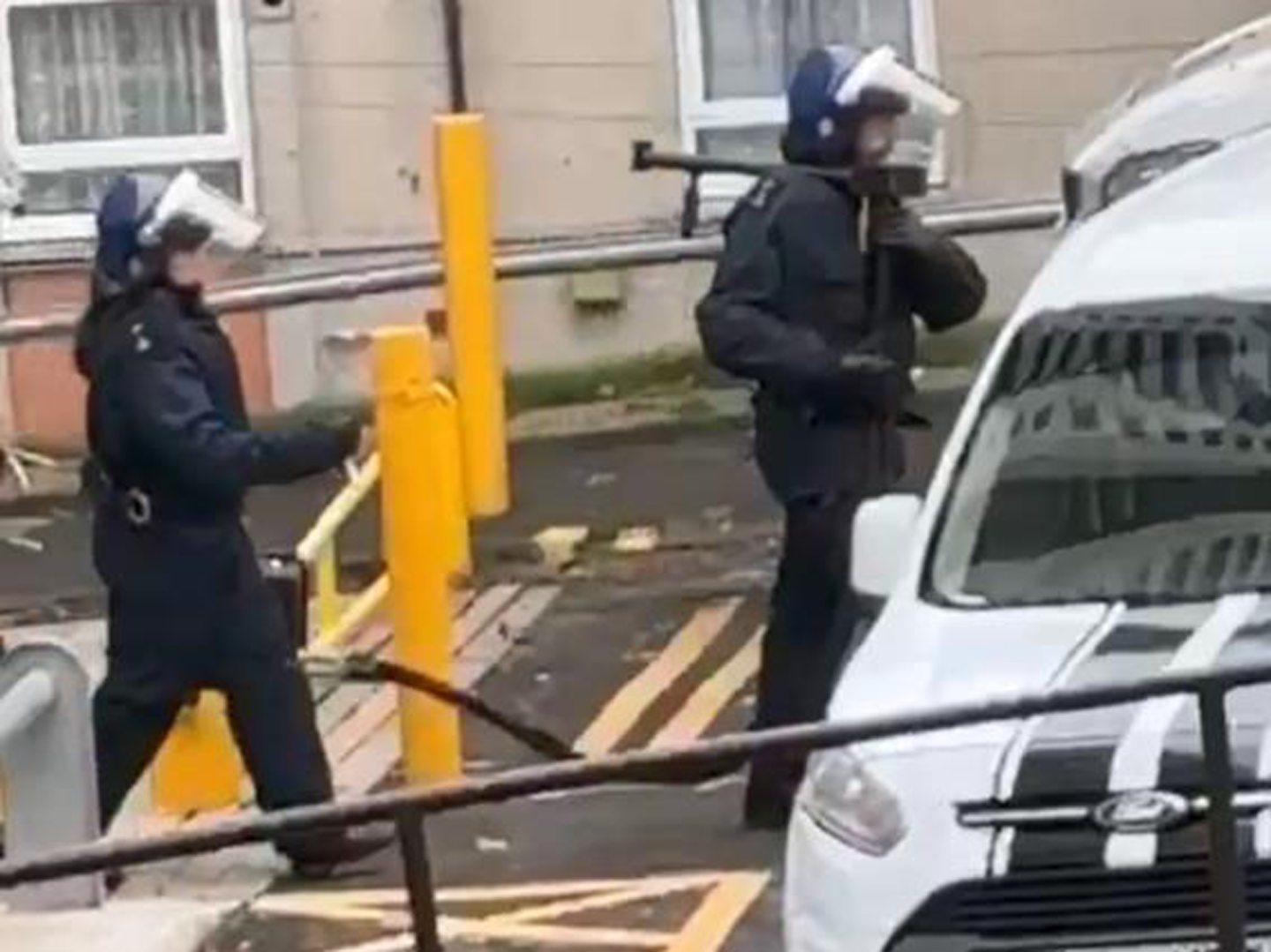 Police in riot gear carry out raids at Dundee Hilltown multi