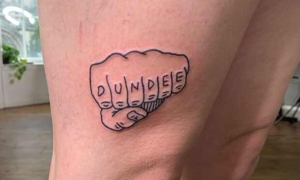 Dundee tattoo artist's six-finger salute to home city goes viral