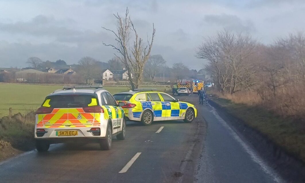 Five in hospital after crash and car fire close main road in Angus