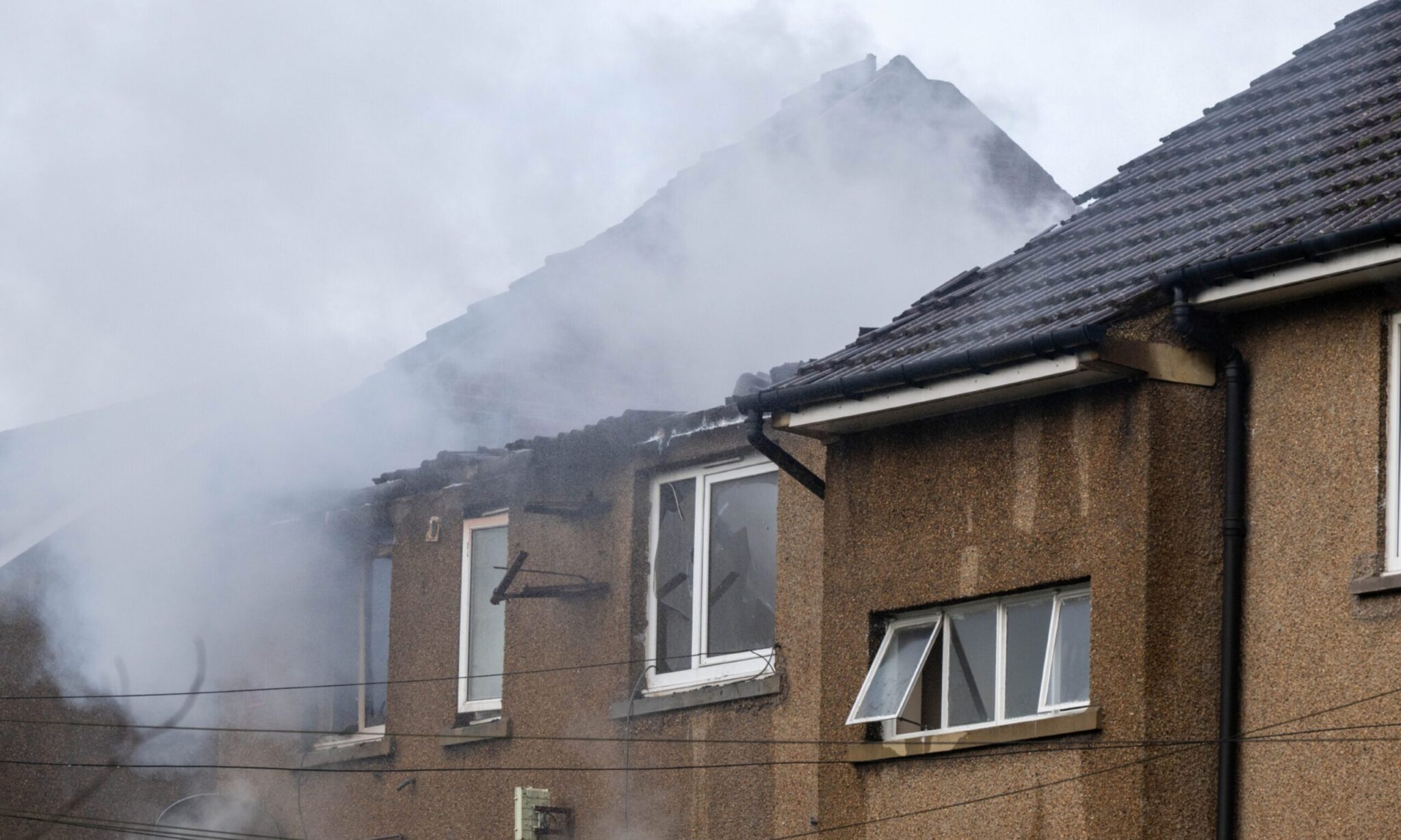 Fire 'completely destroys' roof of Lochee flat as locals evacuated