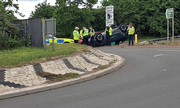 'Huge' queues on A90 in Dundee as car crashes onto roof
