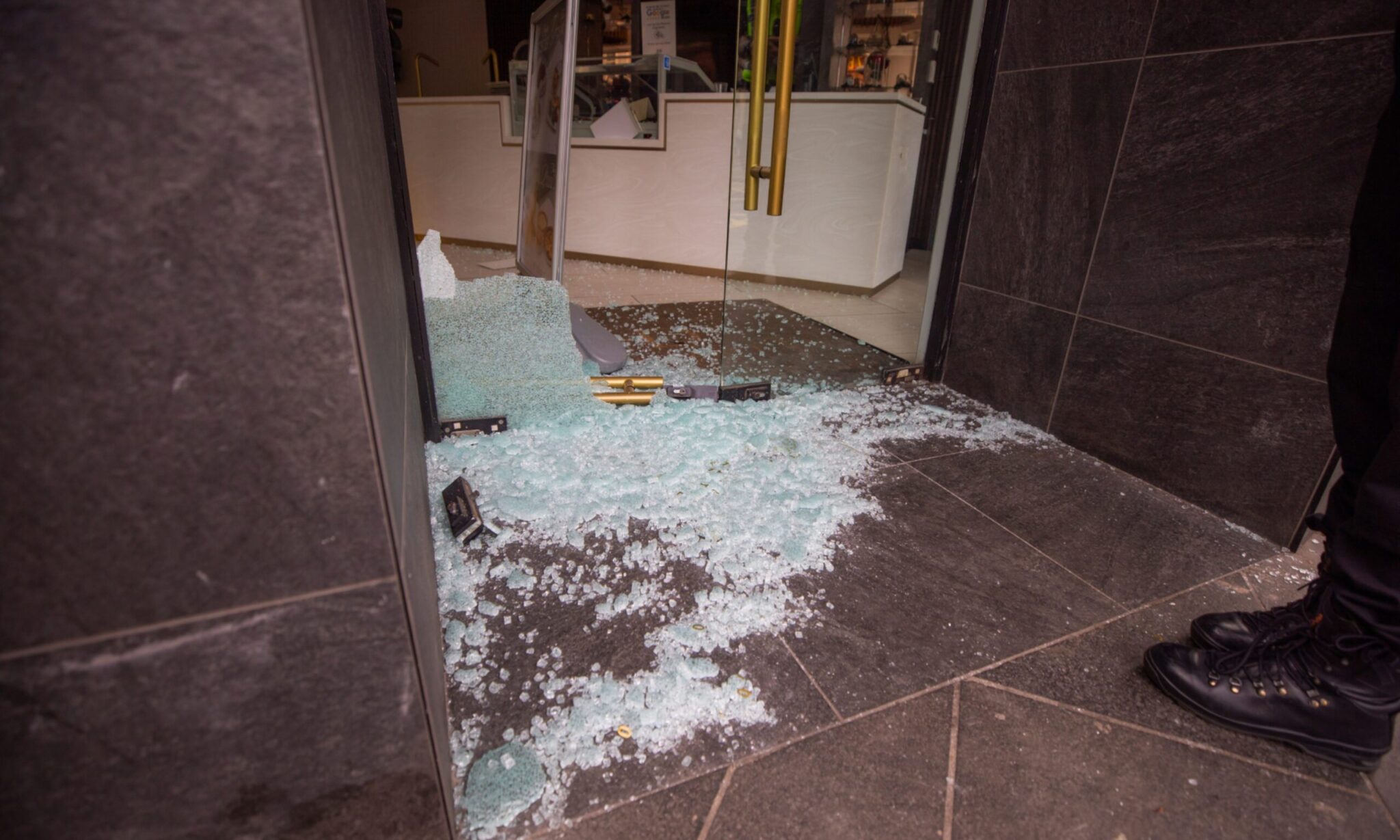 Perth city centre cafe doors smashed as police stand guard