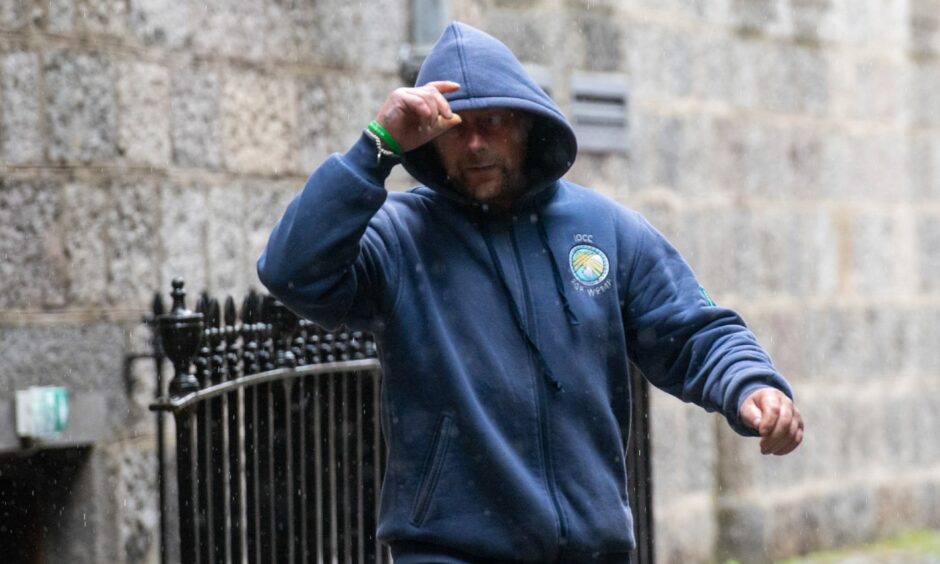 Topless drunk caught peeing in street hurled abuse at public and police