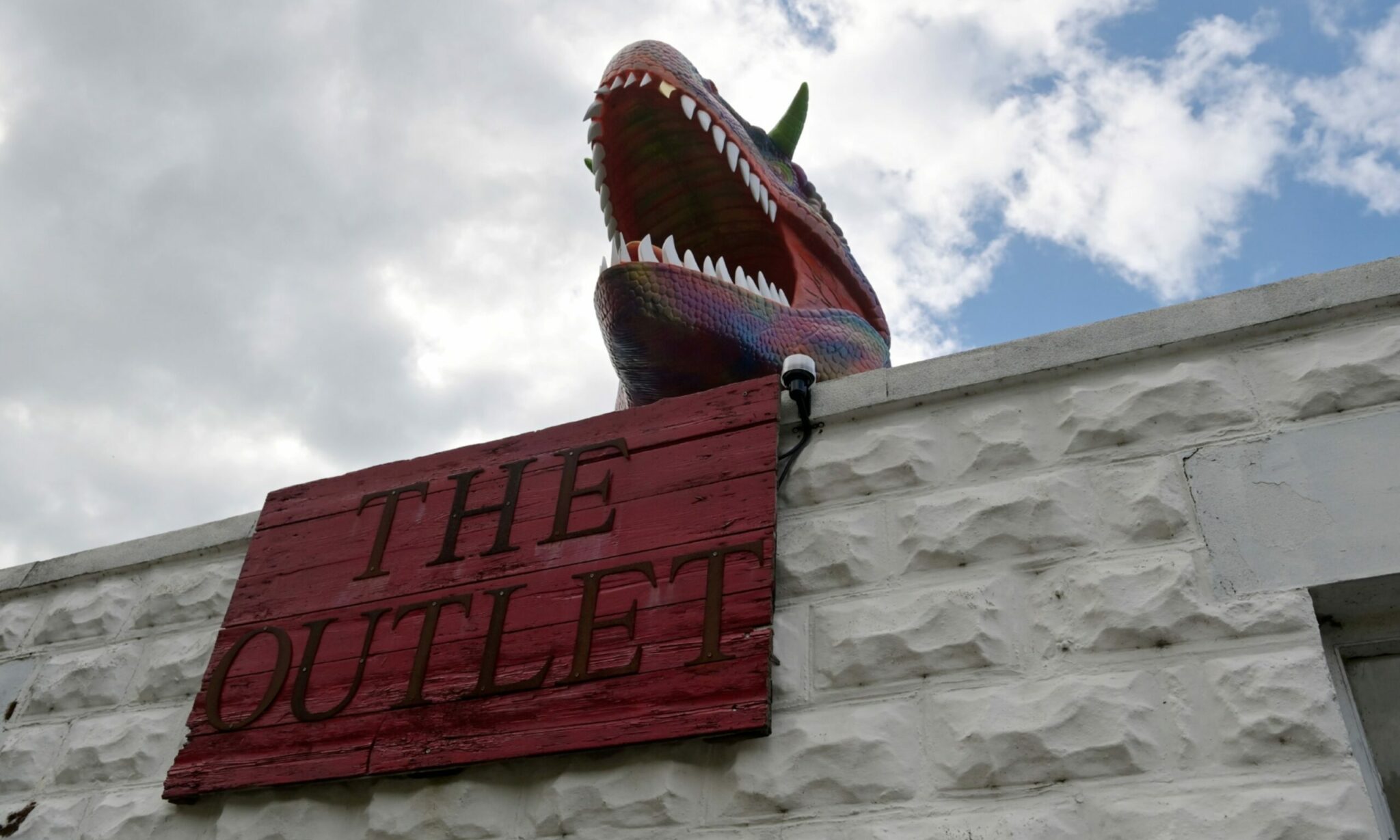 Cullen shop with giant dinosaur head up for auction