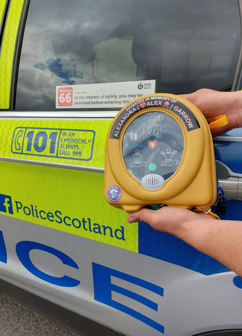 Family of Nairn teen Alex Garrow donate defibrillators to police station