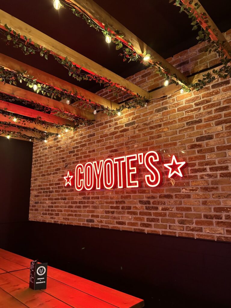 Does new Coyote's location serve the best burgers in Inverness?