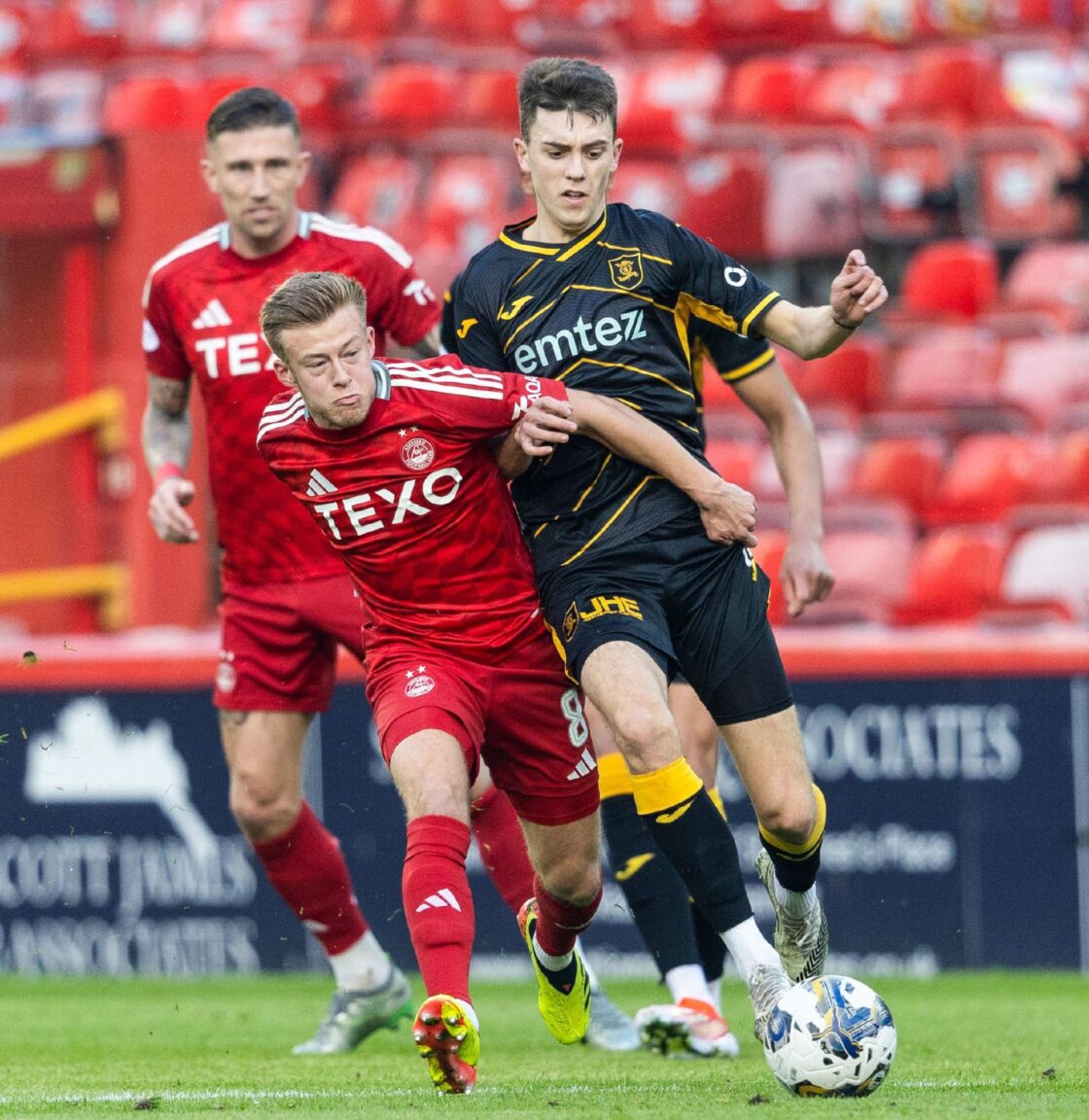 Peter Ambrose and Gavin Molloy sign for Aberdeen
