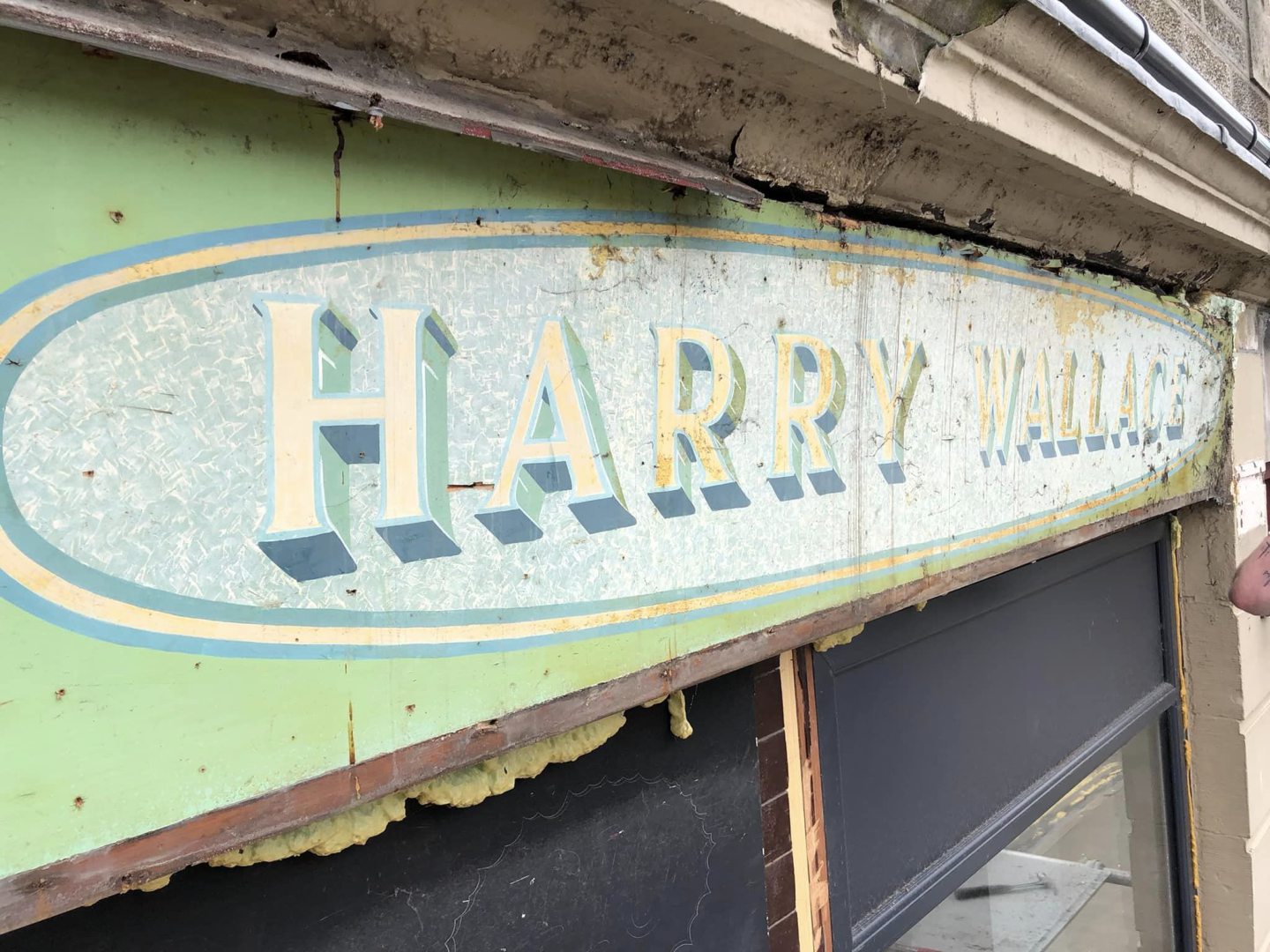 Two old shop signs uncovered during new Buckie business refit