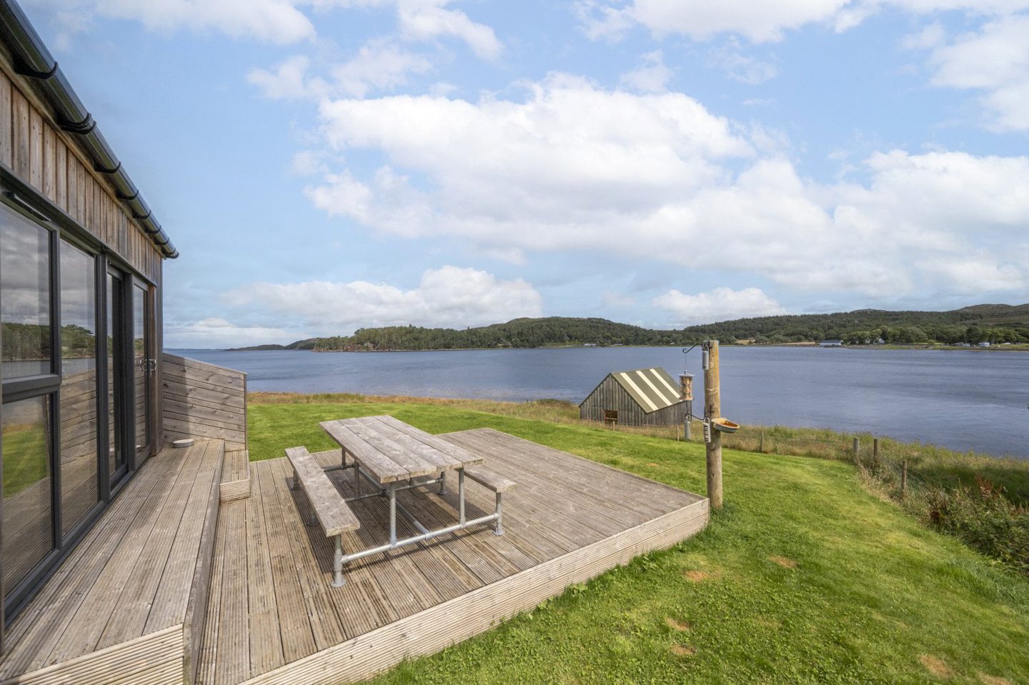 Lochside timber house in Poolewe with panoramic views up for sale