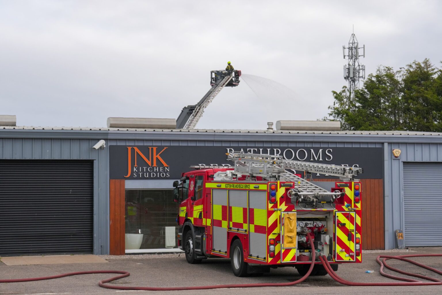 Crews remain scene at Elgin scrap yard blaze