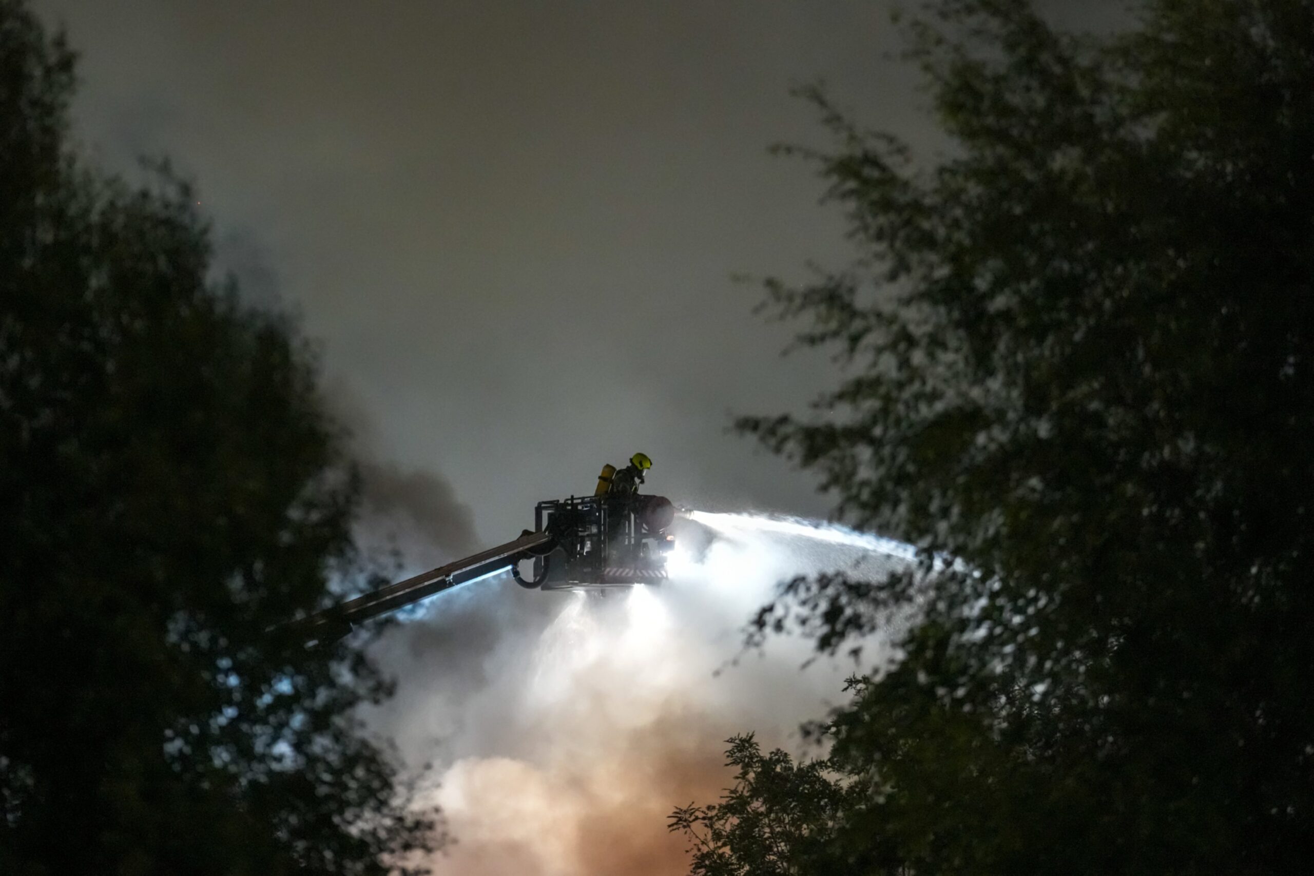 Crews remain scene at Elgin scrap yard blaze