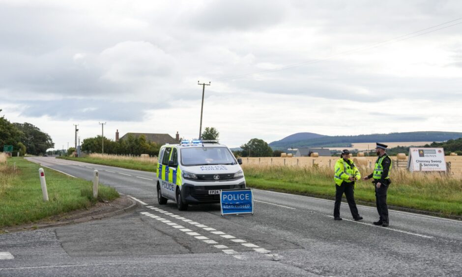 Ambulance and car involved in crash near Buckie