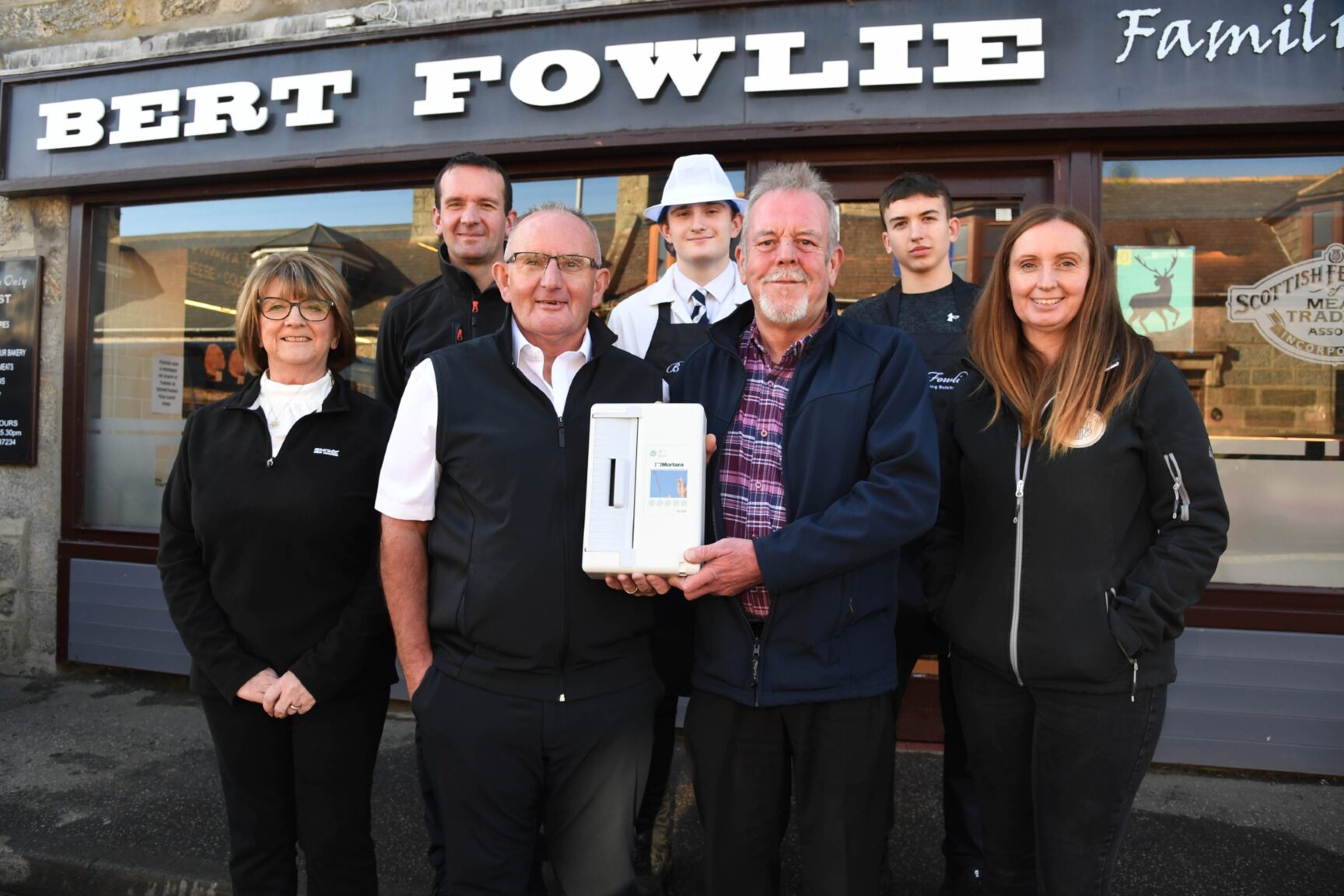 Bert Fowlie Butcher in Strichen celebrates 70 years with donation to GP