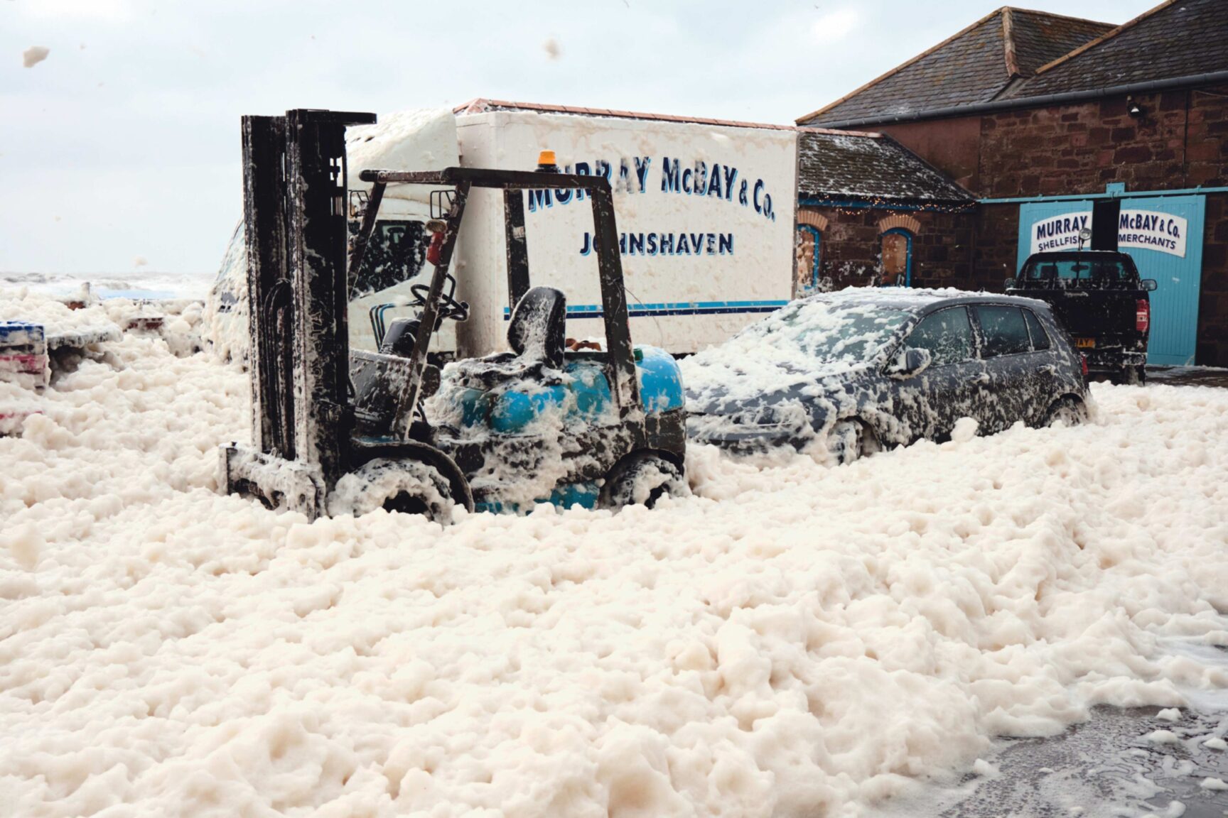 Bubble bath!: Wild weather covers Johnshaven streets in sea foam